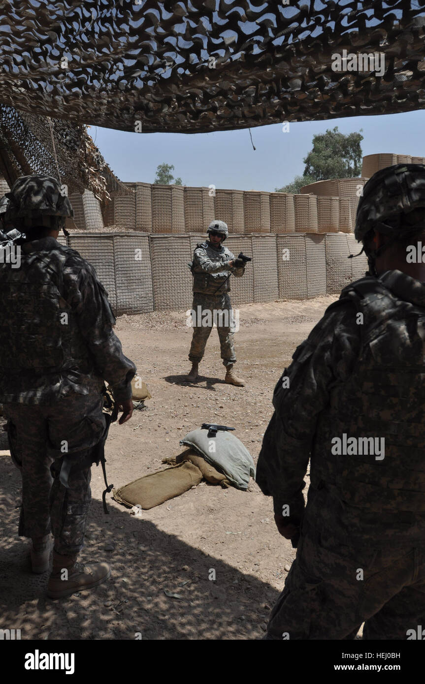 Sgt. Bryan Tull, Birmingham, Ala, native, demonstrates how to properly ...
