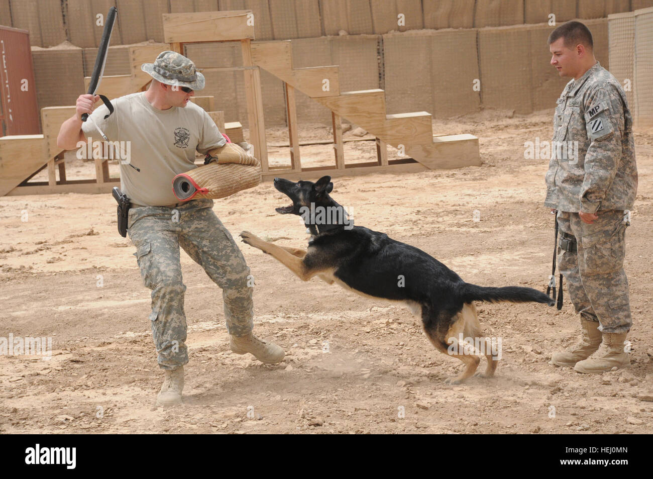 Sgt. Daniel Turner (left), a military working dog handler and trainer ...