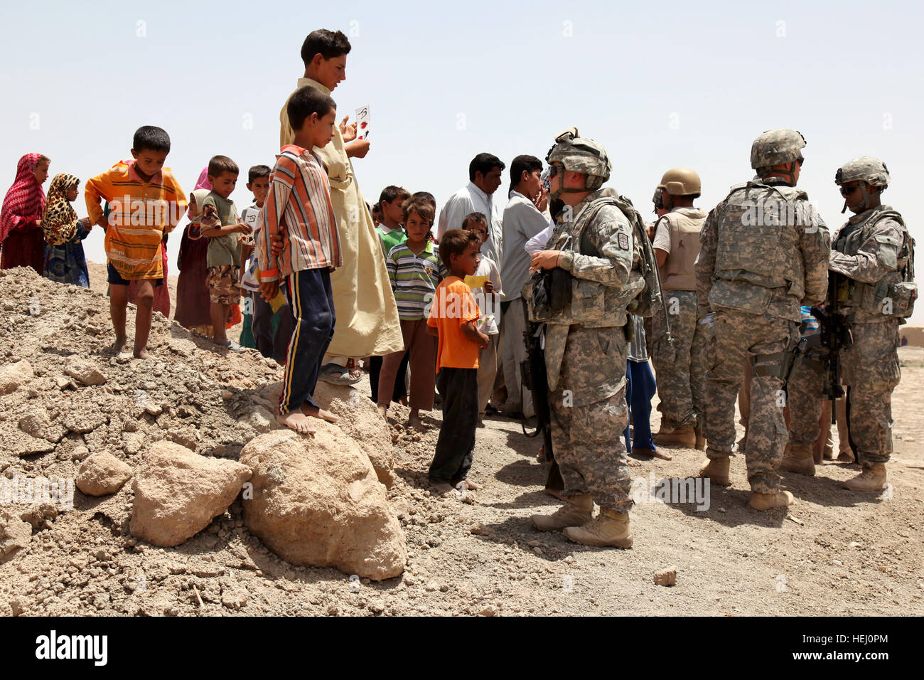 U.S. Army Soldiers from 445th Civil Affairs Battalion speak with local ...