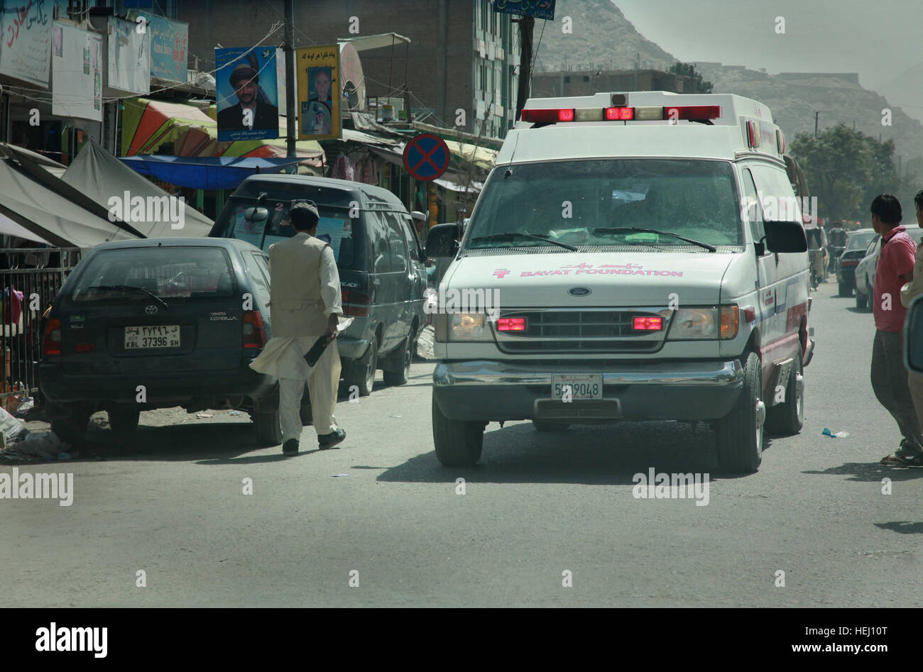 An ambulance with California license plates drives through downtown ...