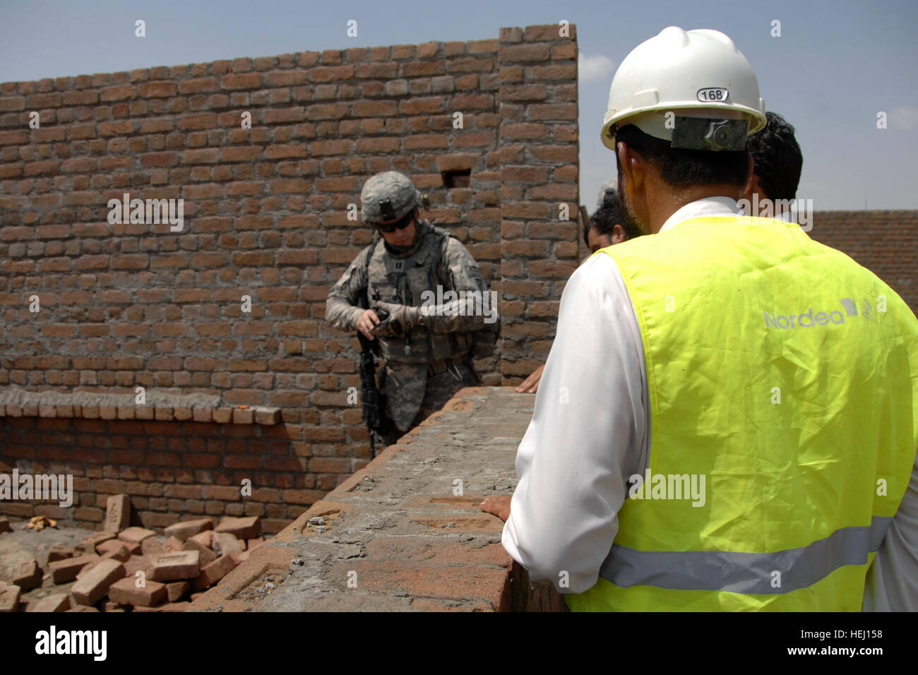 Air Force Capt. Erik Rauglas, left, an engineer with the Nangarhar ...