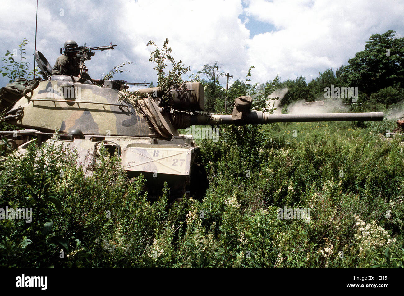 An M-60 aggressor forces tank group maneuvers through the field during ...