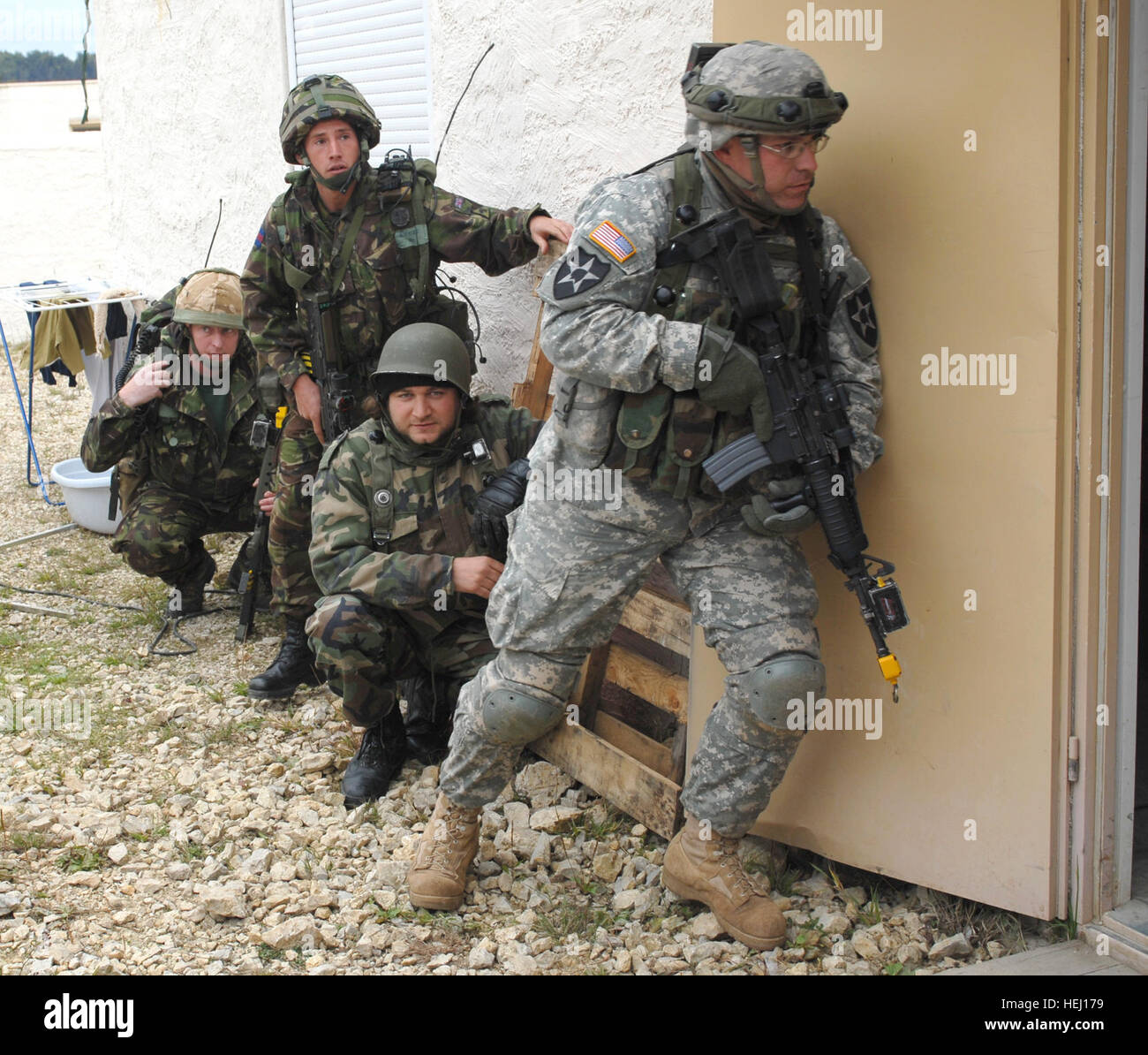 Spc. Rich Olson, 3rd Stryker Brigade Combat Team, leads the 7th Platoon ...