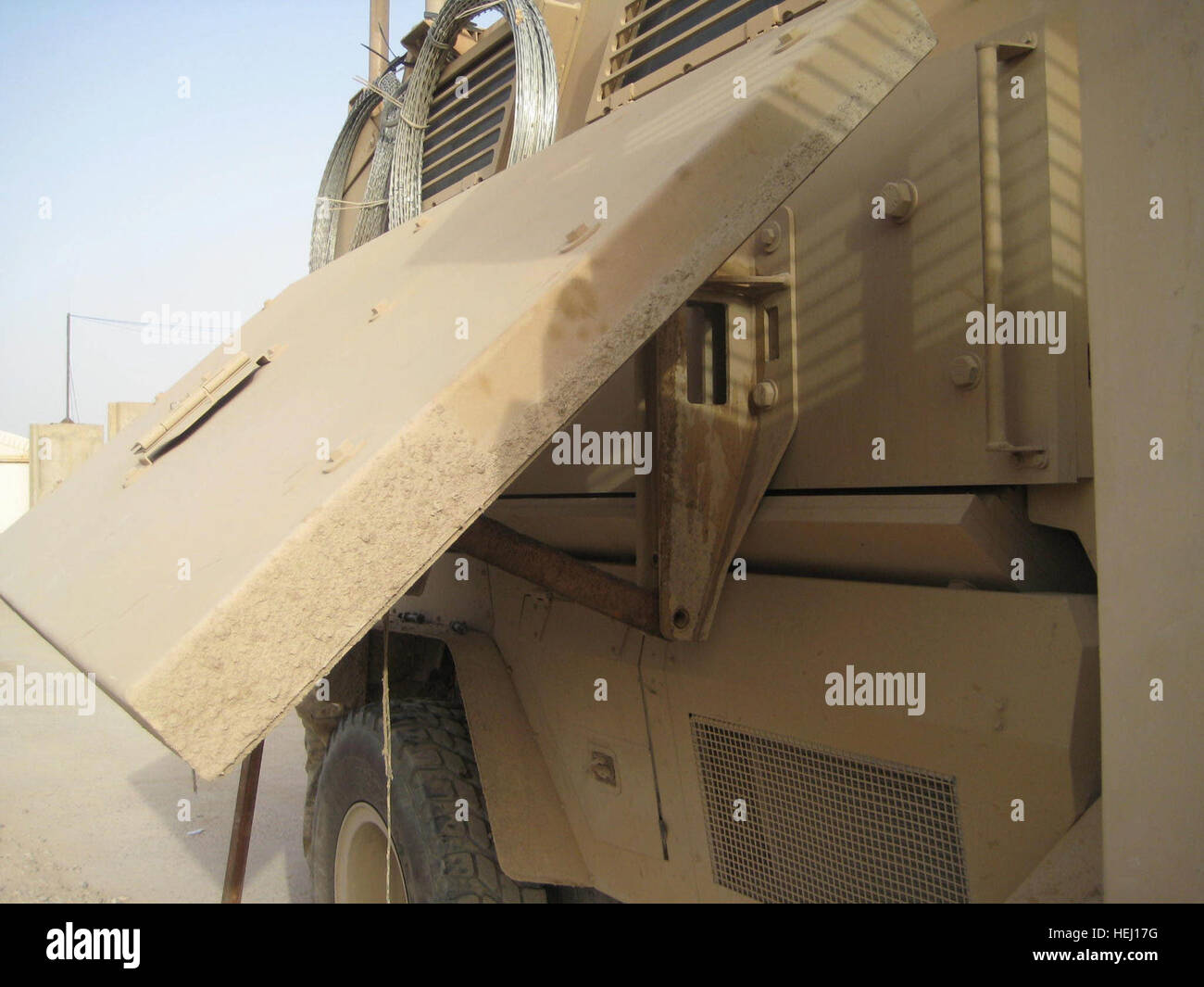 A Mine Resistant Ambush Protected (MRAP) vehicle is shown using a pair ...