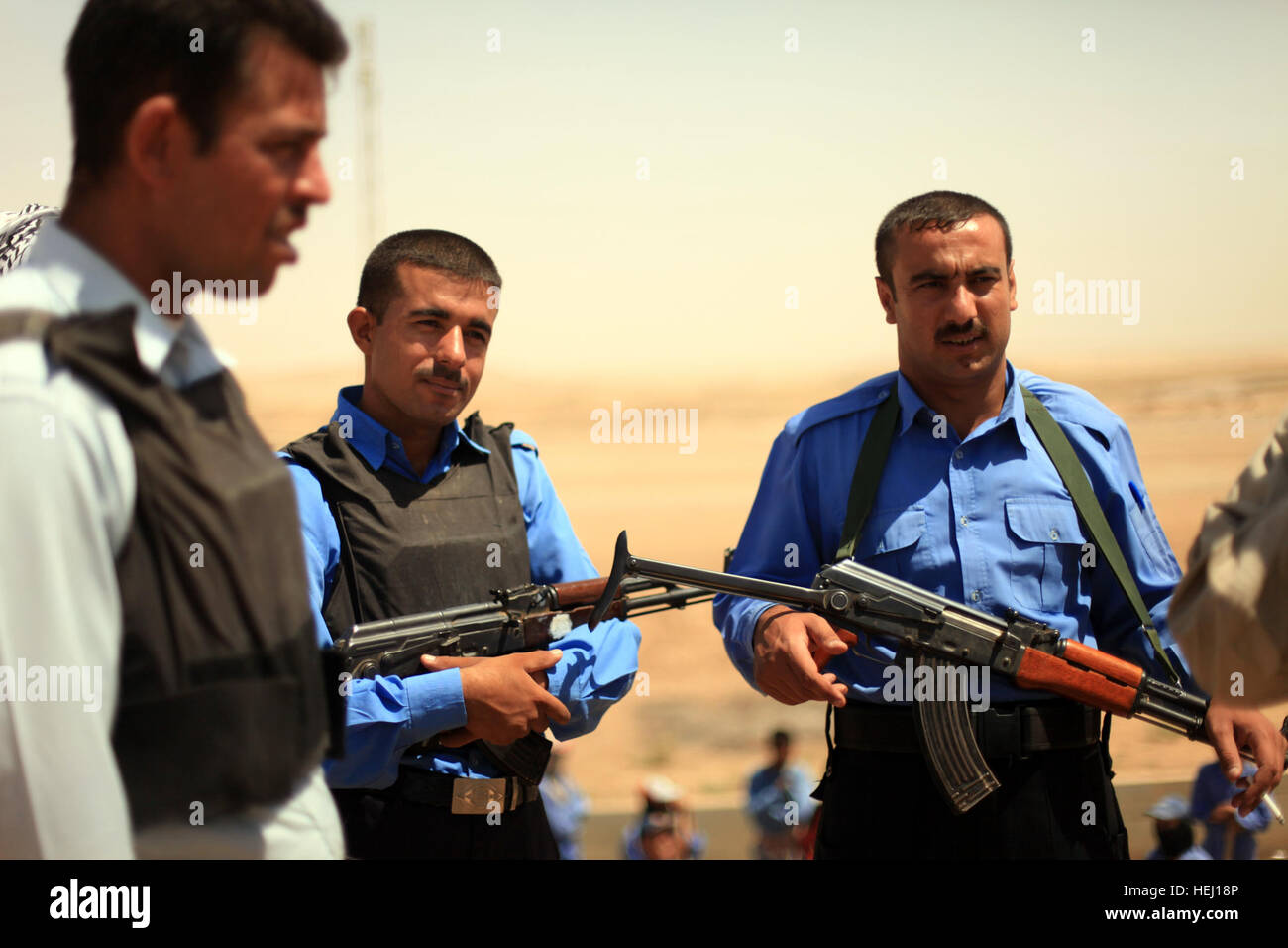 Iraqi police officers pull security with U.S. Soldiers, from 1st ...