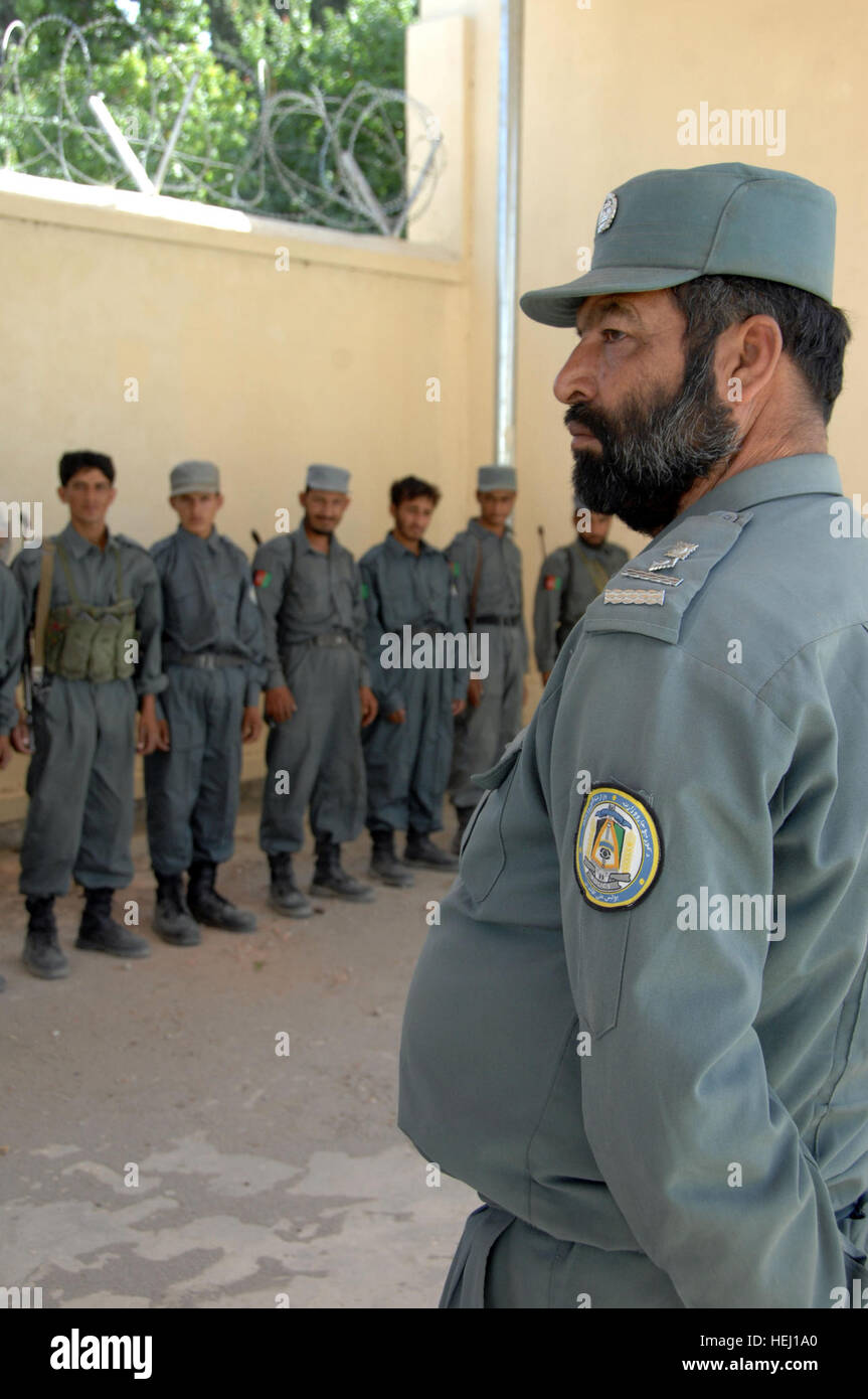 A leader directs members of the Afghanistan national police as they ...