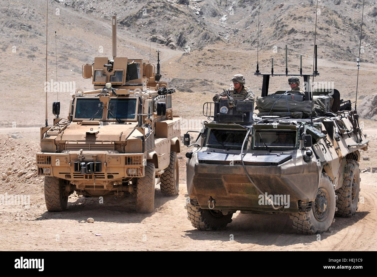 A Task Force Warrior Mine Resistant Ambush Protected Vehicle and a Task ...