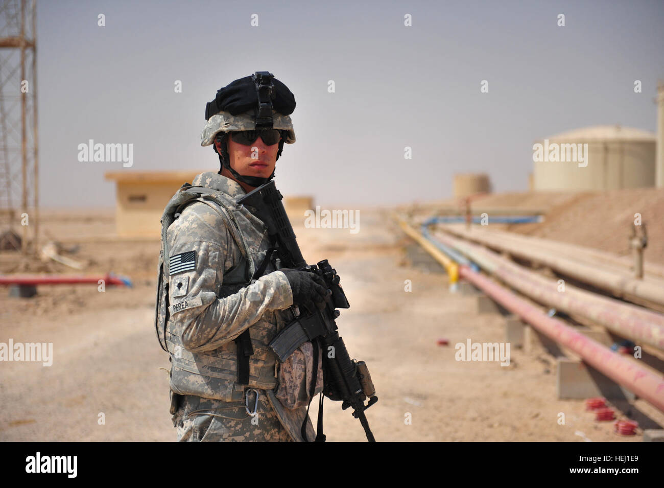 Spc. John Perea of Thornton, Colo., conducts security for the members ...