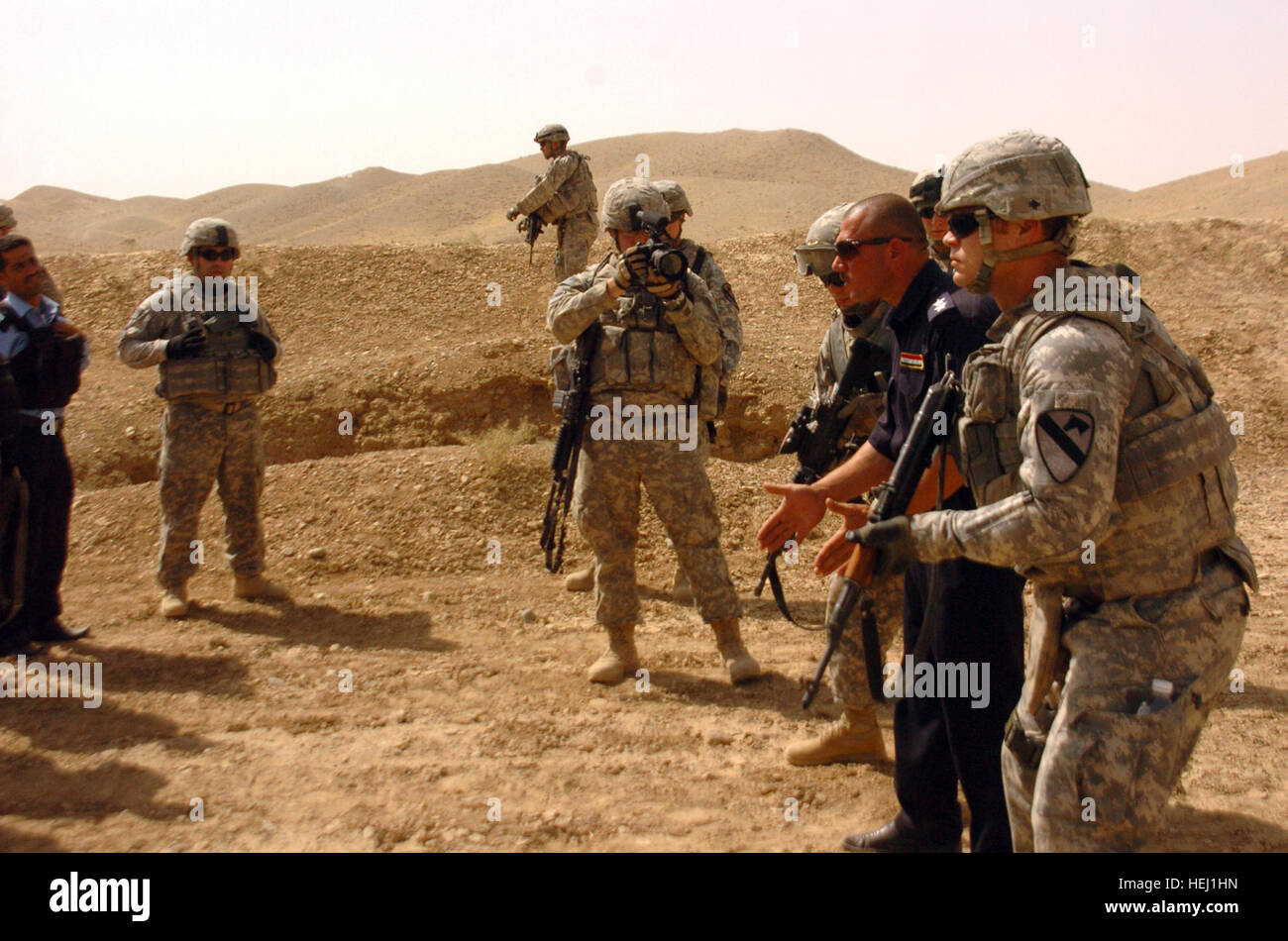 A first lieutenant from the Daquq Iraqi Police Station, and U.S ...