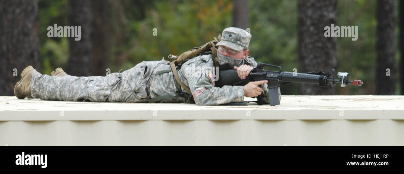 A Fort Polk WLC Soldier maintains a fighting position on top of a house ...