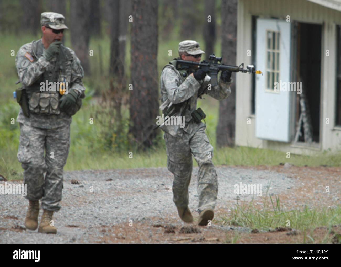A Fort Polk Warrior Leadership Course Soldier (left) runs from cover ...