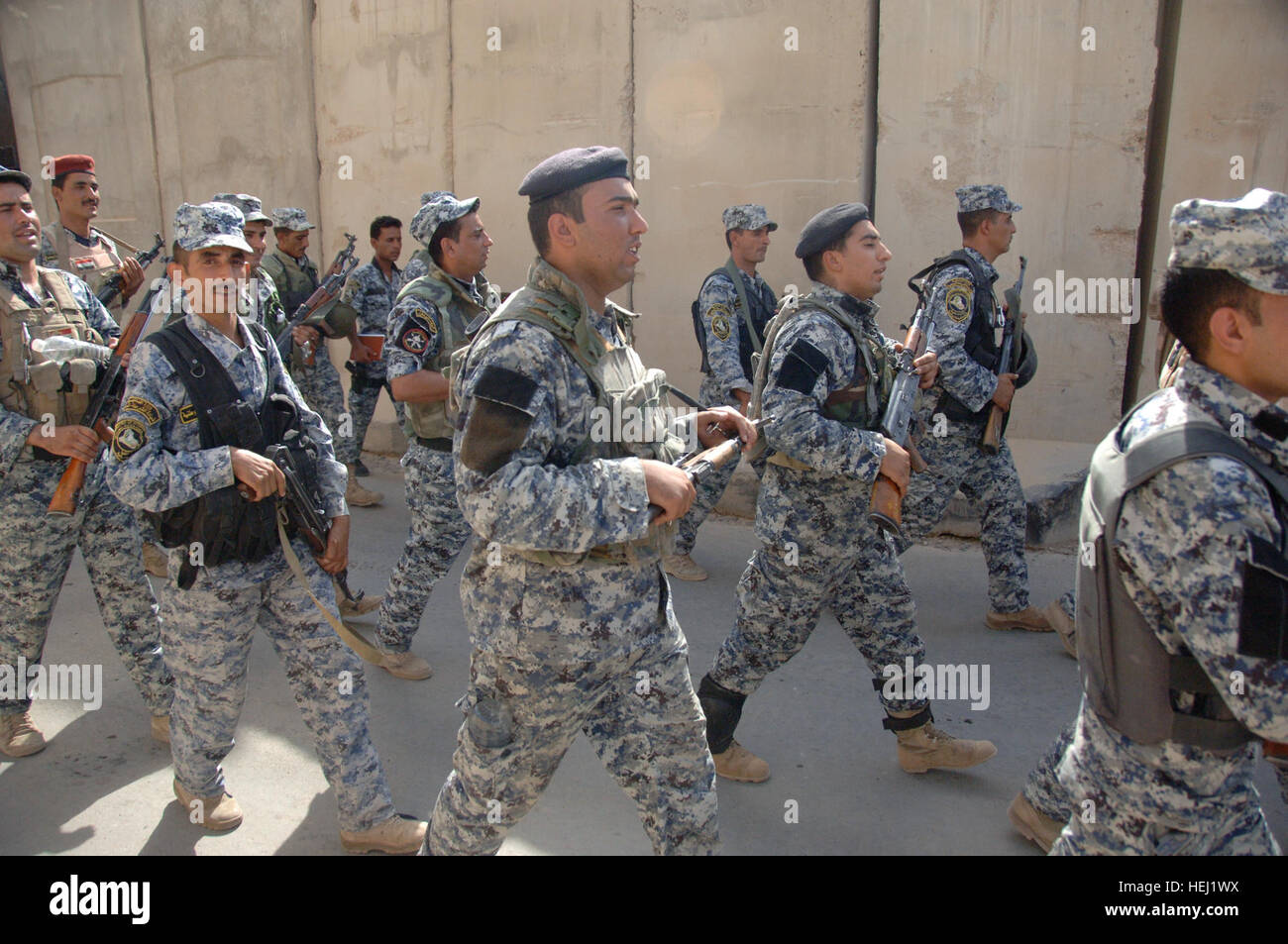 Iraqi security forces from the 1st National Police Division, march to ...