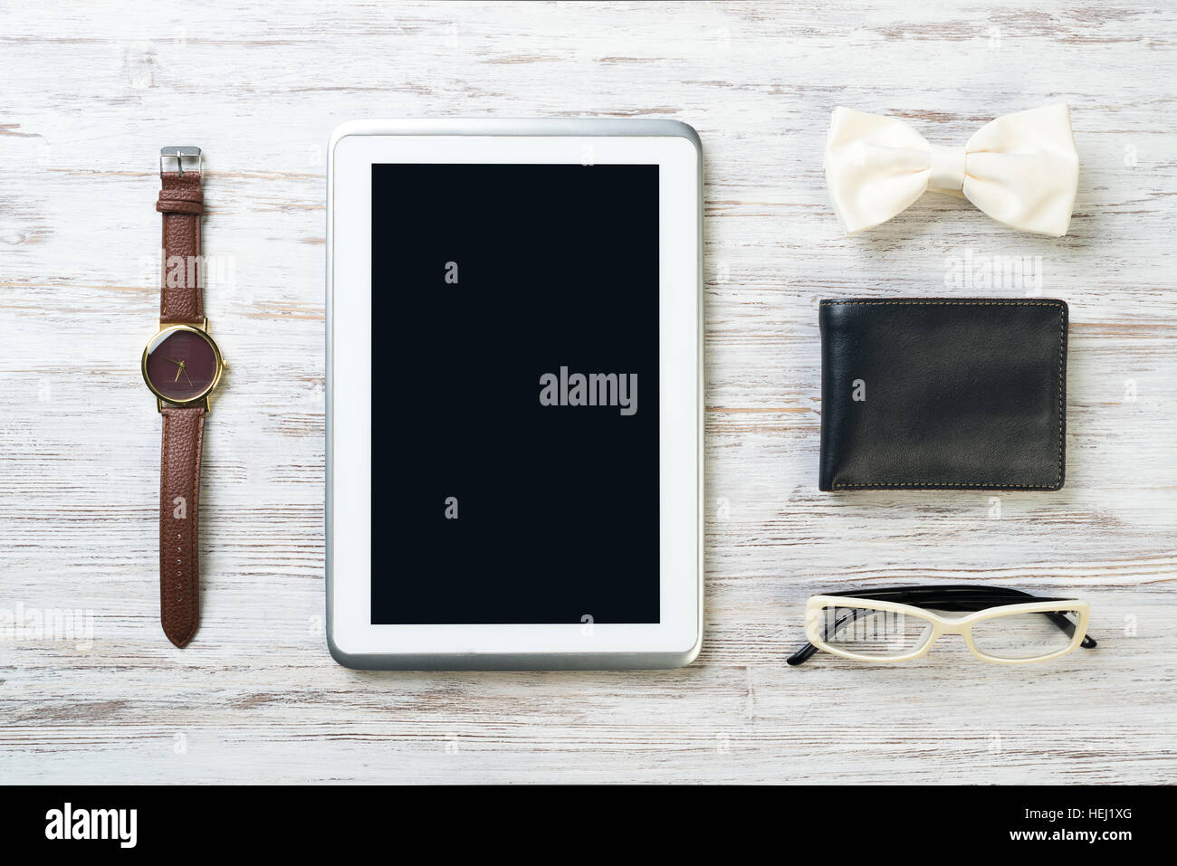 Gentleman kit of tablet watch glasses bow tie and notebook on wooden ...