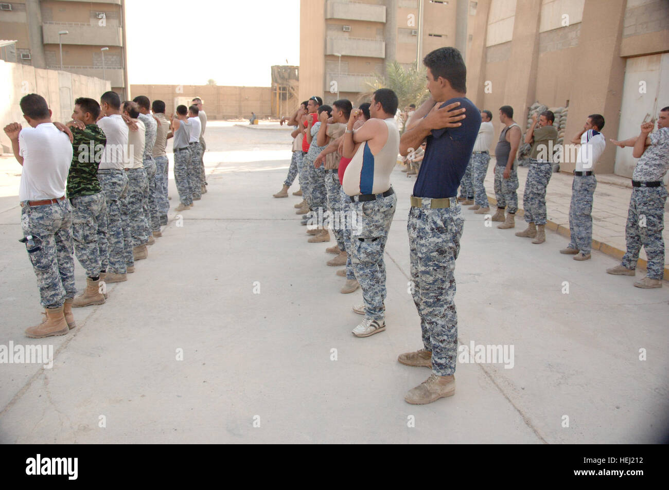 Iraqi security forces from the 1st National Police Division stretch ...
