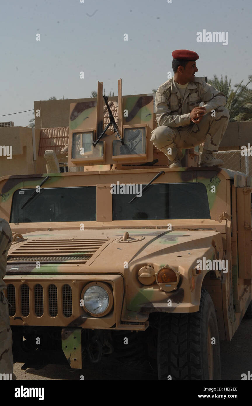 An Iraqi soldier guards the outside gate of a medical clinic during a ...