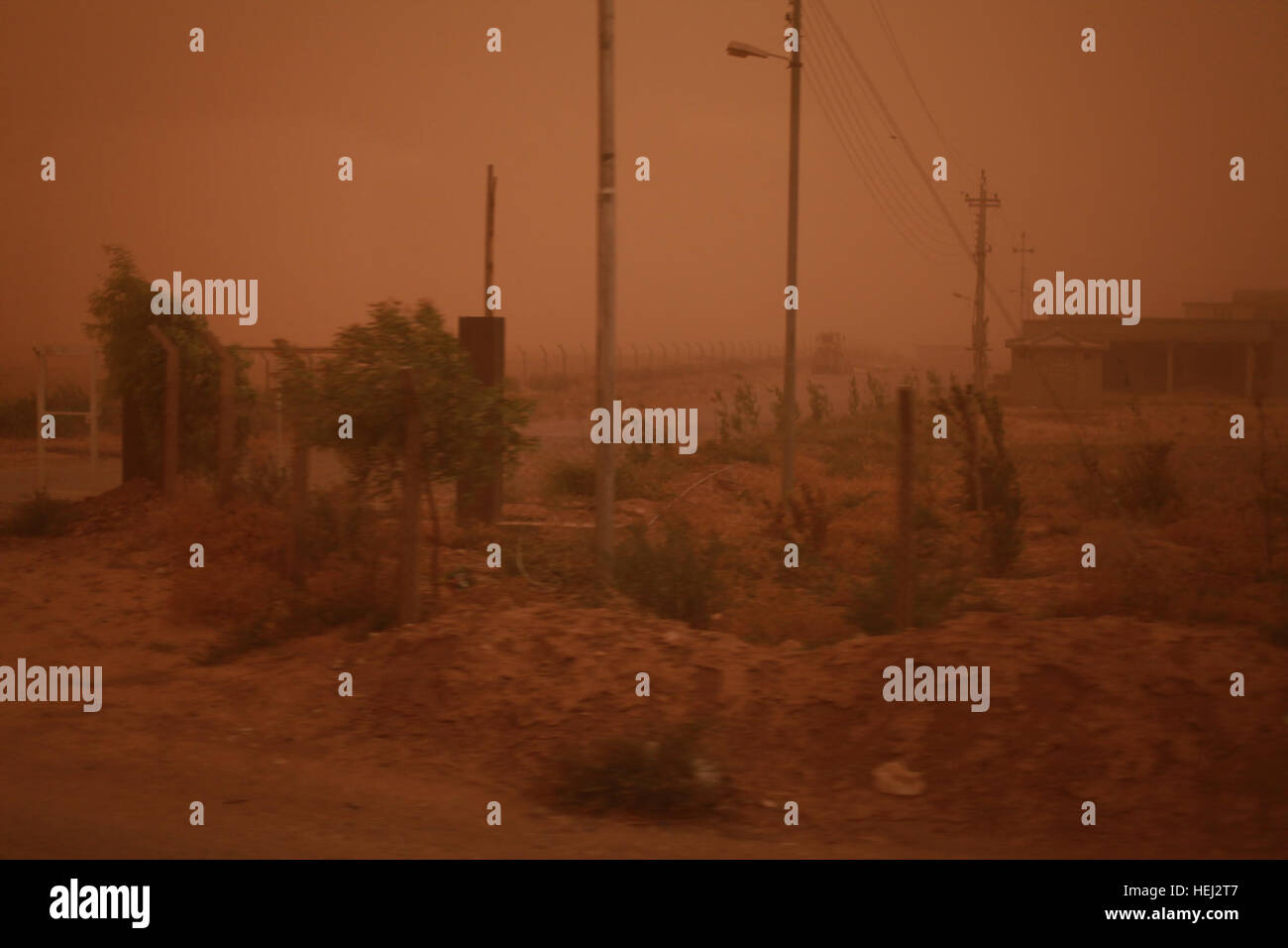 A dust storm ensues as Iraqi police and U.S. Soldiers with the 1st ...