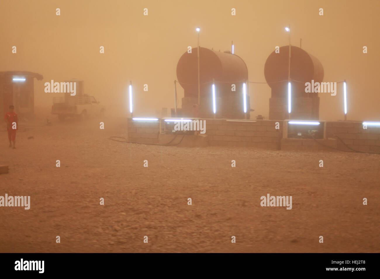 A dust storm ensues as Iraqi police and U.S. Soldiers with the 1st ...