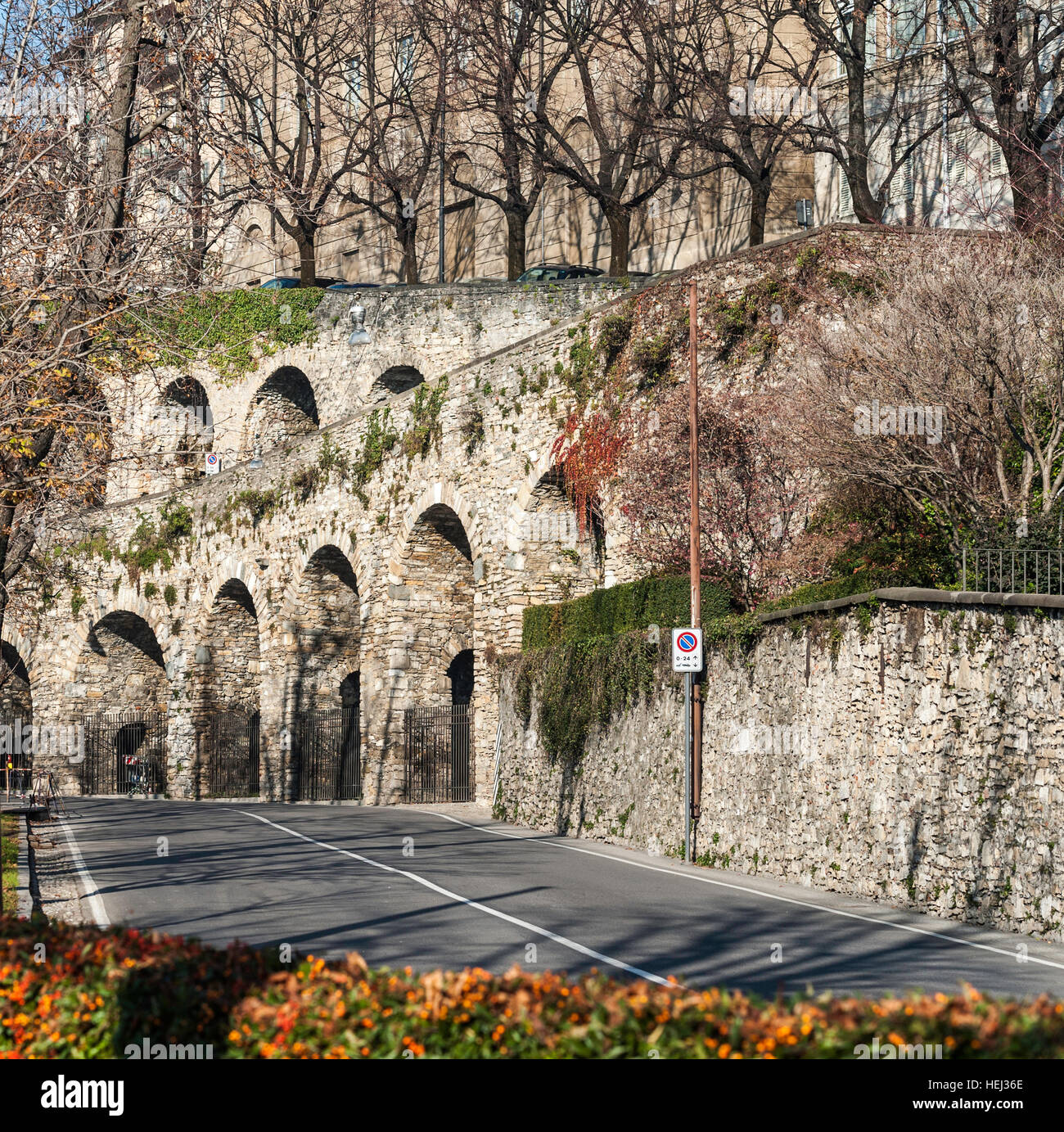 Street with old castle wall ruins in Bergamo town, Italy Stock Photo ...