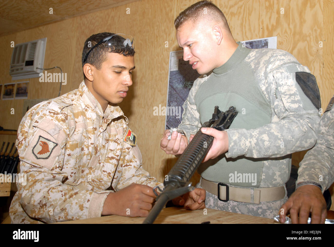 US Army 51038 Sgt. Heriberto Fuentes (right), of Bradenton, Fla., shows ...