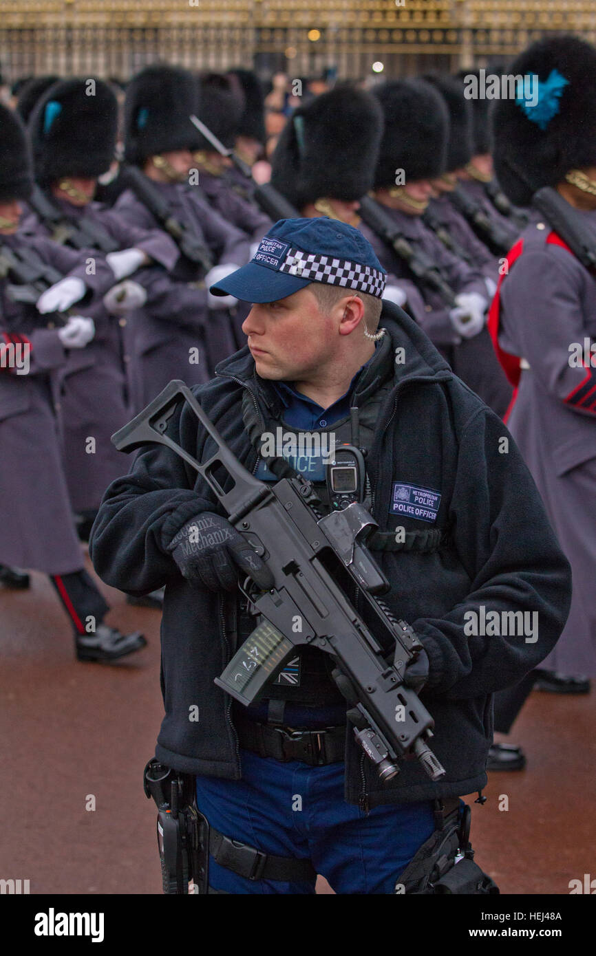 Armed police provide security during the Changing of the Guard outside ...
