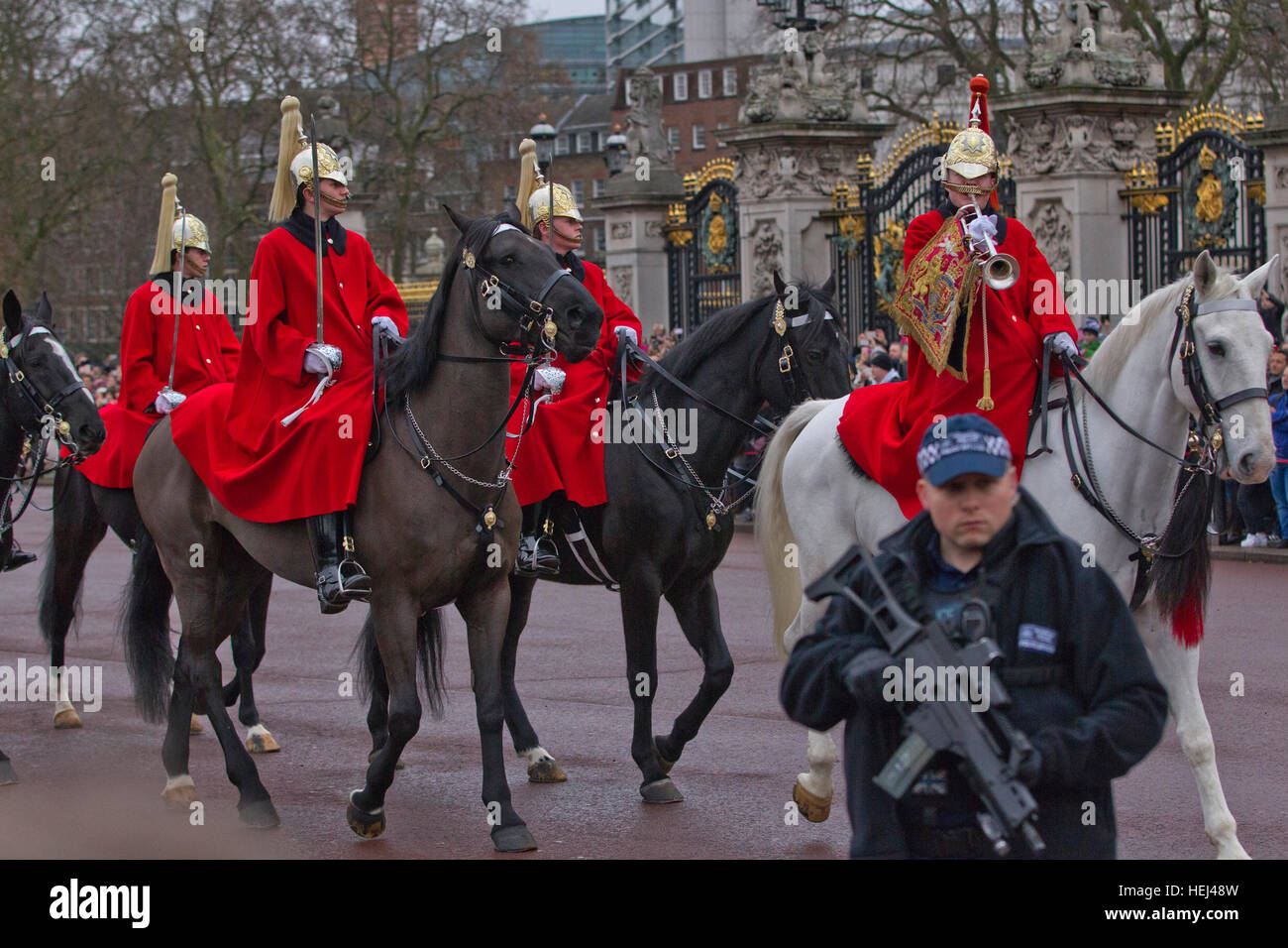 Armed police provide security during the Changing of the Guard outside ...