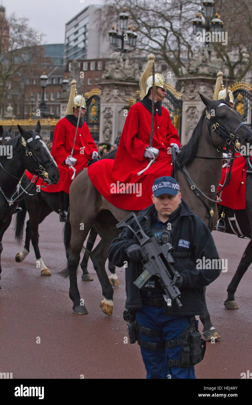 Armed police provide security during the Changing of the Guard outside ...