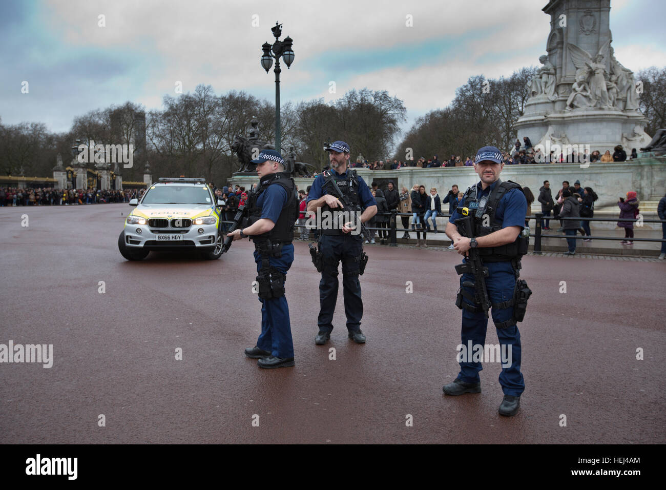 Armed police provide security during the Changing of the Guard outside ...