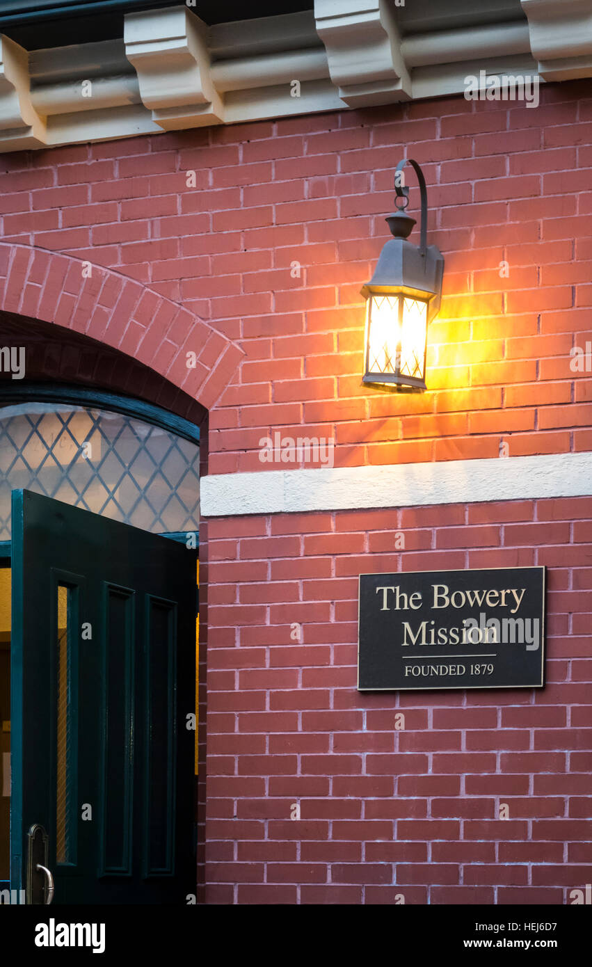 A welcoming lamp hangs outside the entrance to the Bowery Mission in ...