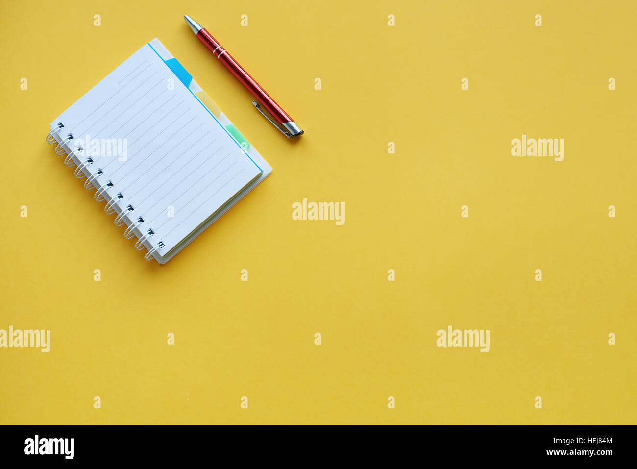 Pen lying next to open the notebook Stock Photo - Alamy