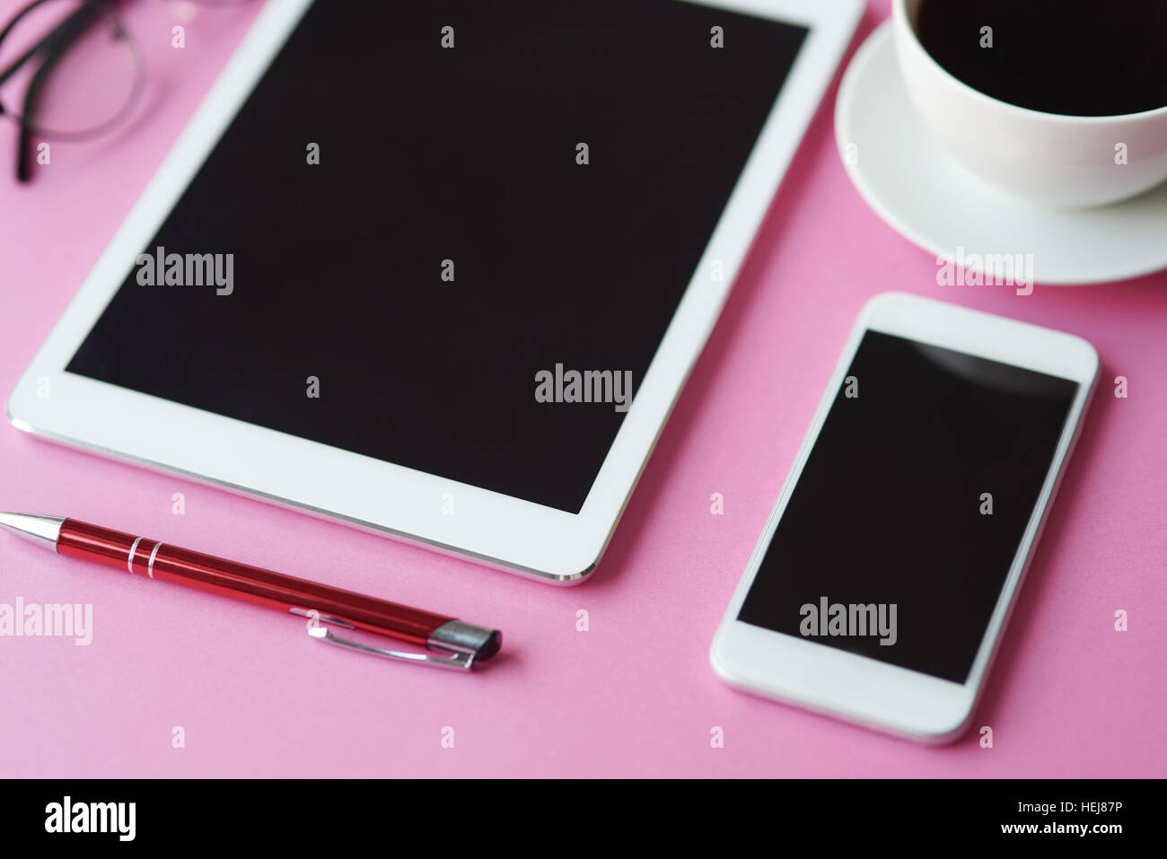 Cup of coffee smartphone and tablet Stock Photo - Alamy