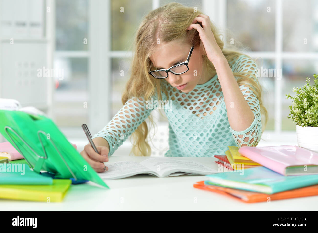 teenager girl doing homework Stock Photo - Alamy