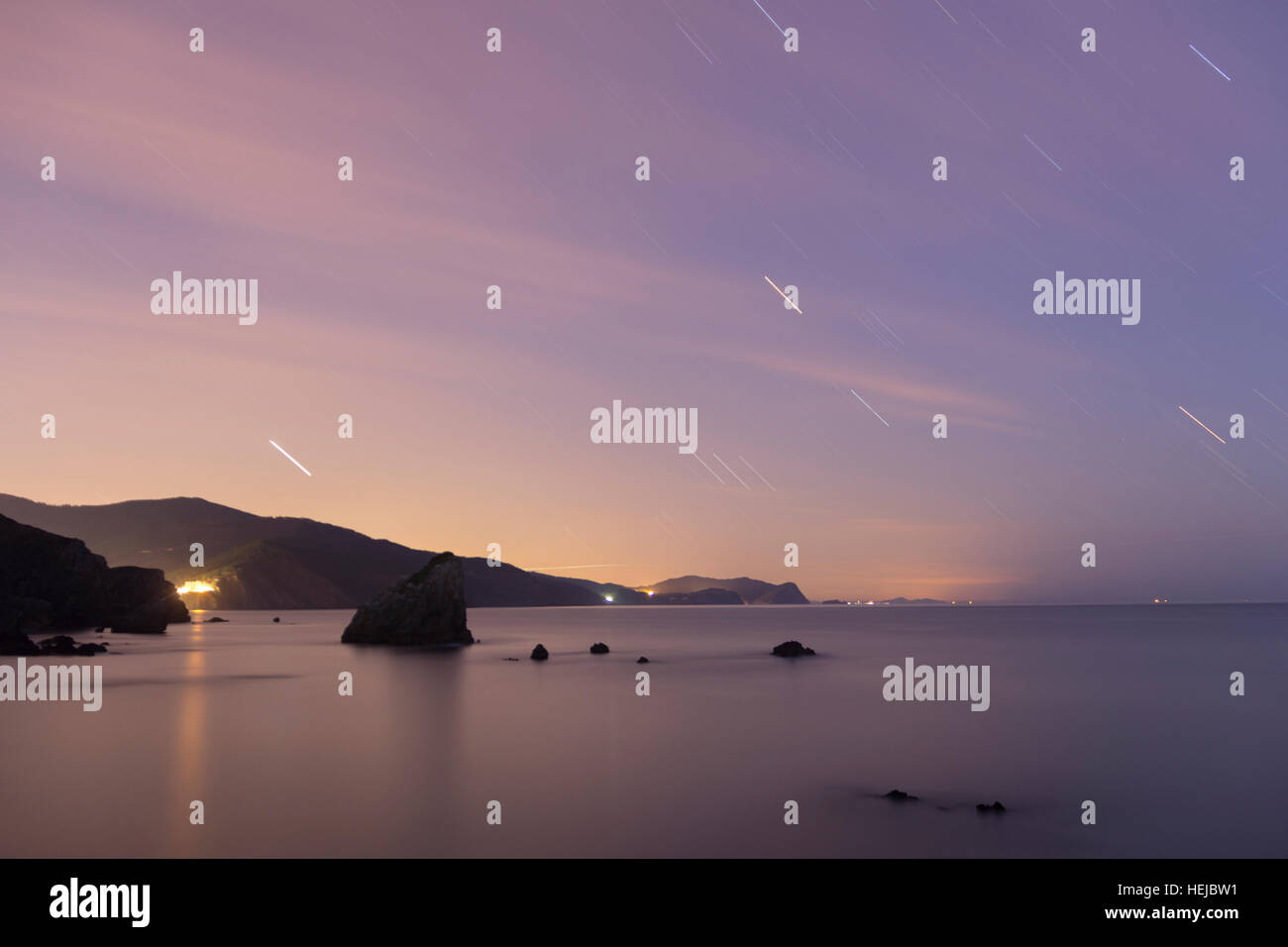 rocks in the coast at night Stock Photo - Alamy