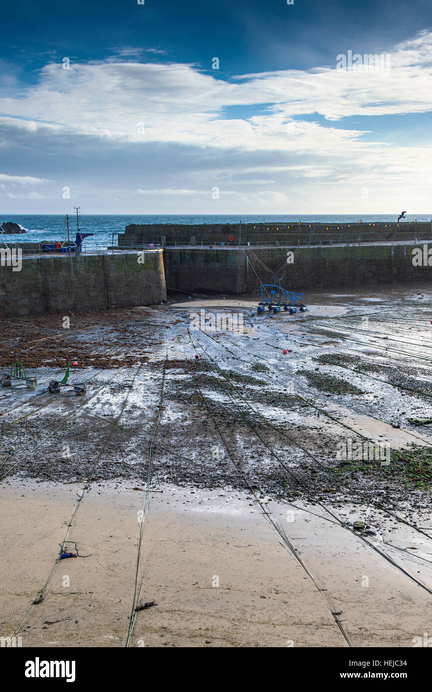 Low tide in Mousehole Harbour in Cornwall, England, UK Stock Photo - Alamy