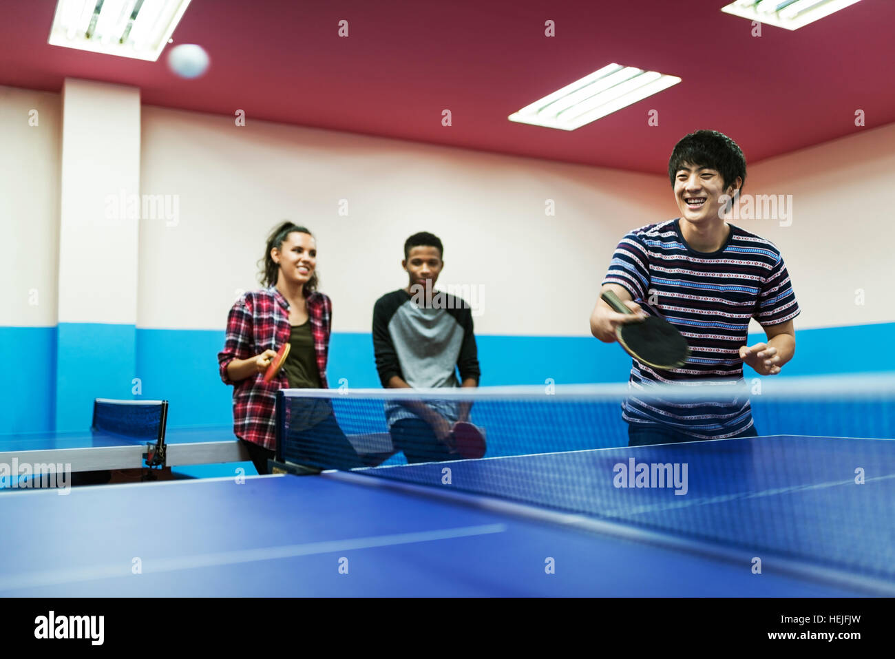 Diverse friends playing tennis hi-res stock photography and images - Alamy