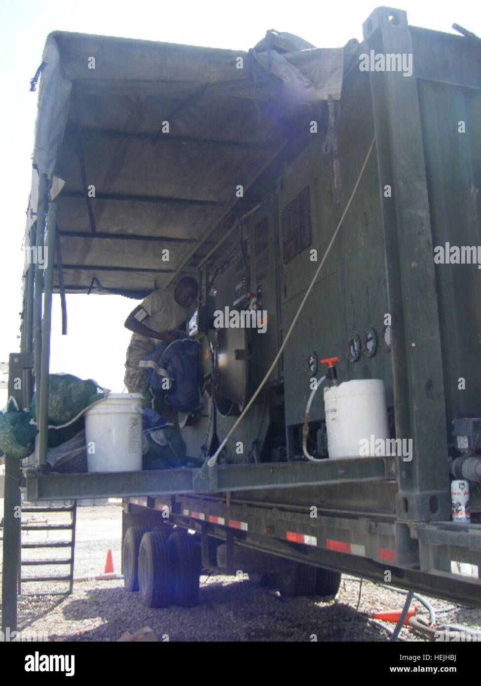 Pfc. Antonio Marquez Bailey, a laundry and textile specialist assigned ...