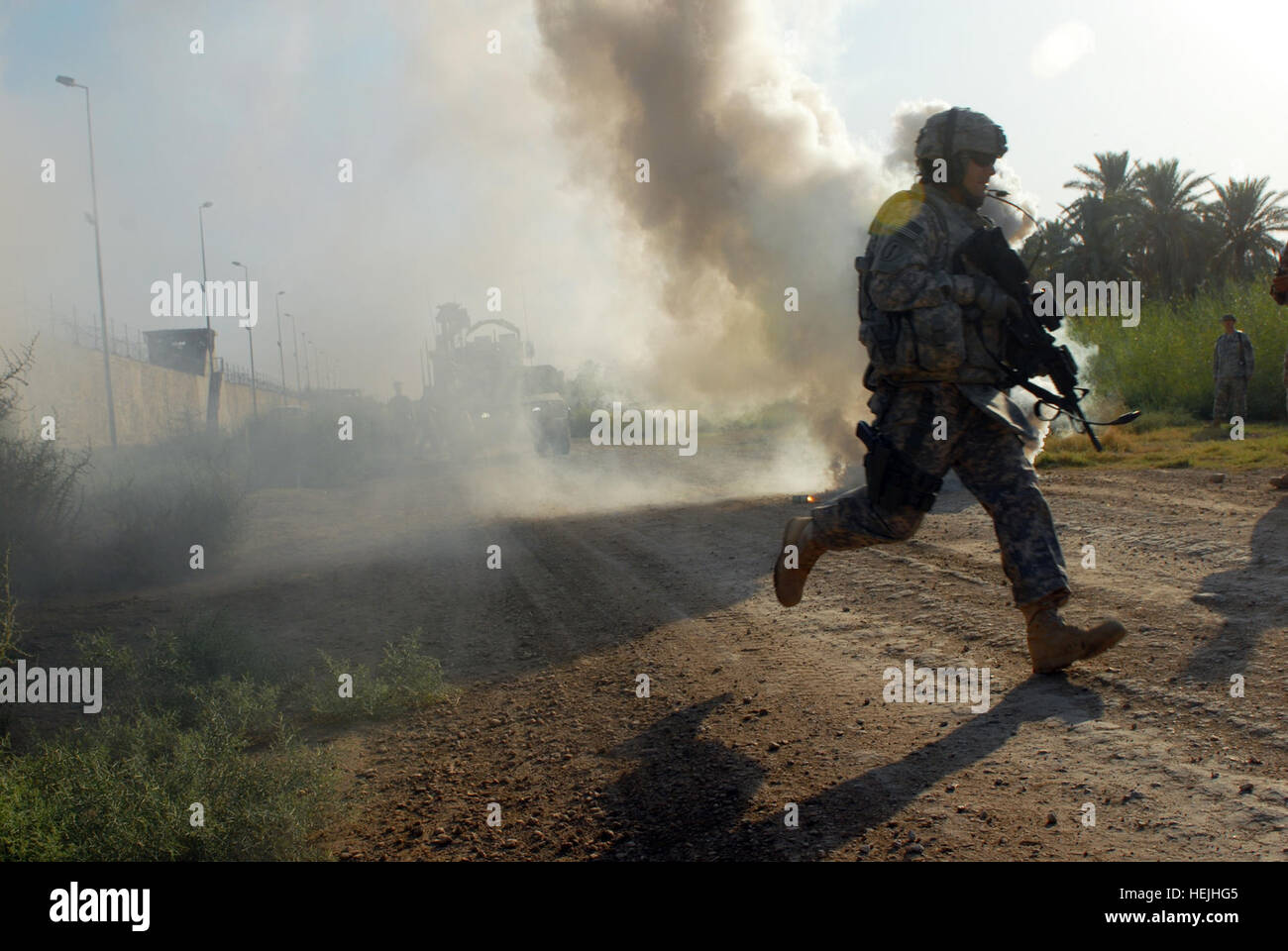 U.S. Soldiers deploy a smoke grenade to mark a landing zone for medevac ...