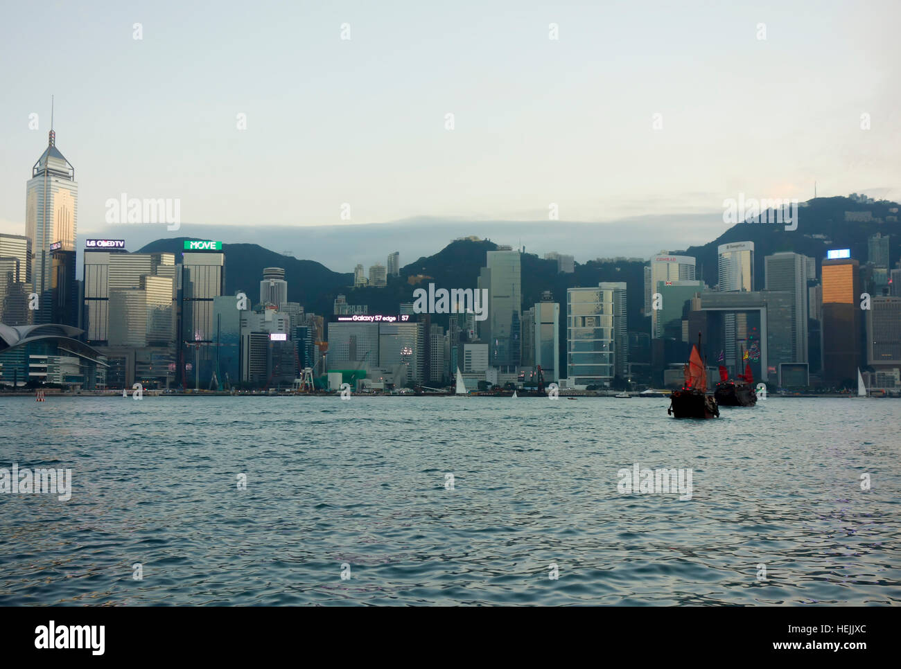 Hong Kong Skyline and panorama cityscape with traditional Chinese Junk ...