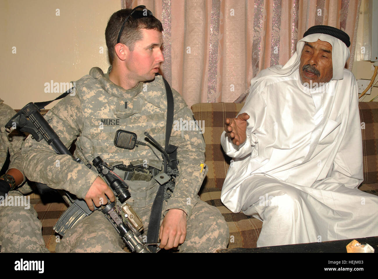 1st Lt. Peter Muse (left), from Boston, listens as Sheikh Yasin ...