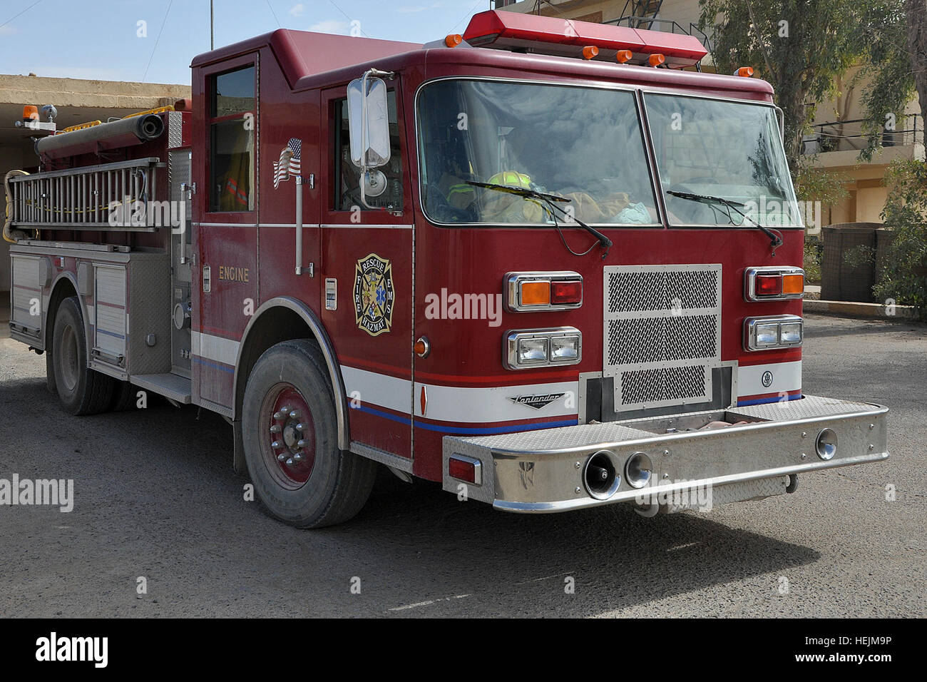 US Army 53443 A Q-West fire department truck waits for a fire emergency ...