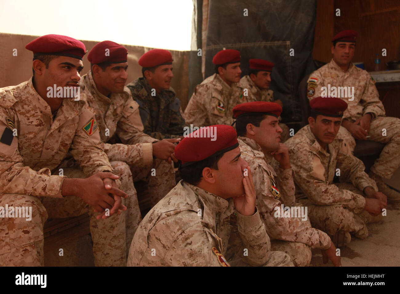 Iraqi soldiers listen while U.S. Army Spc. Christopher Damaso, from ...