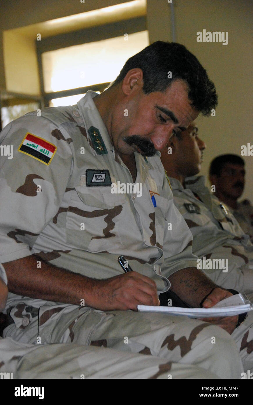 US Army 52955 CAMP TAJI, Iraq- An Iraqi Army Sergeant Major, assigned ...