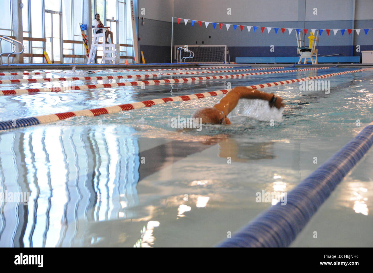 Retired U.S. Army Command Sgt. Maj. Johnathan Fisher swims laps in the ...