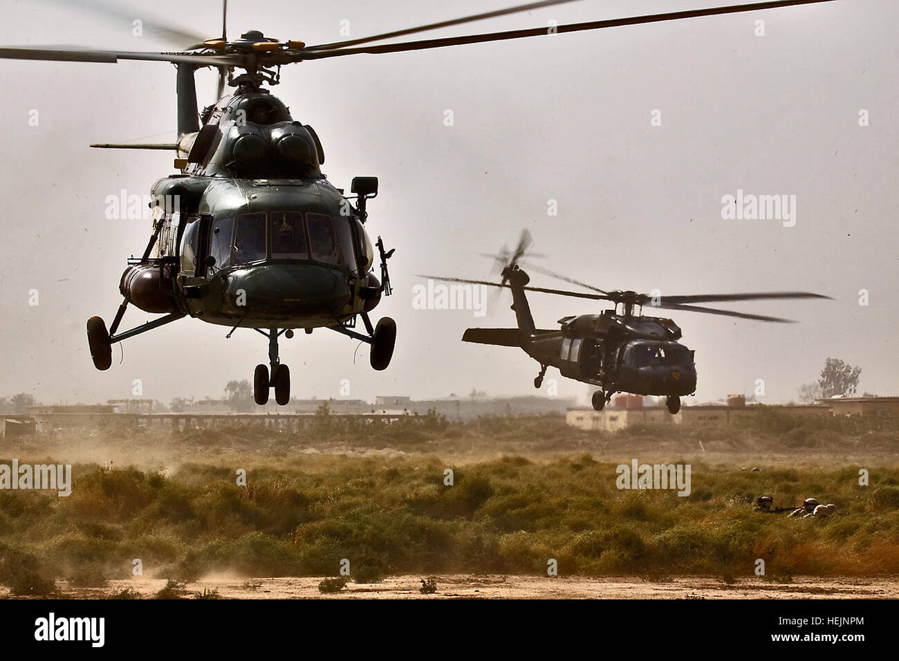 US Army 53450 CAMP TAJI, Iraq-An MI-17 Hip helicopter (left) from the ...