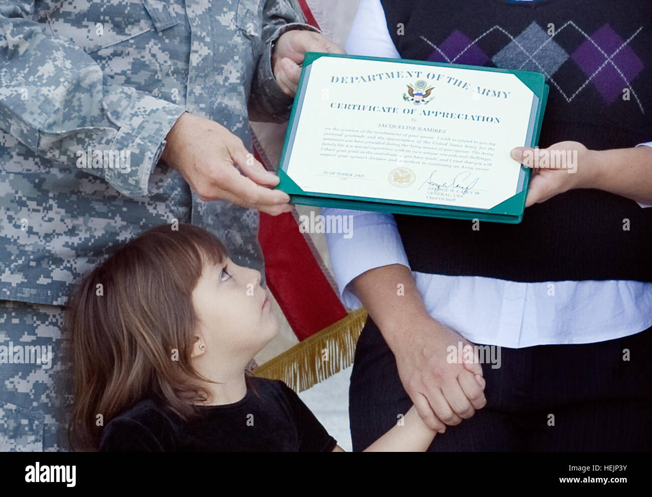 The daughter of Jacqueline Ramirez looks at the Certificate of ...