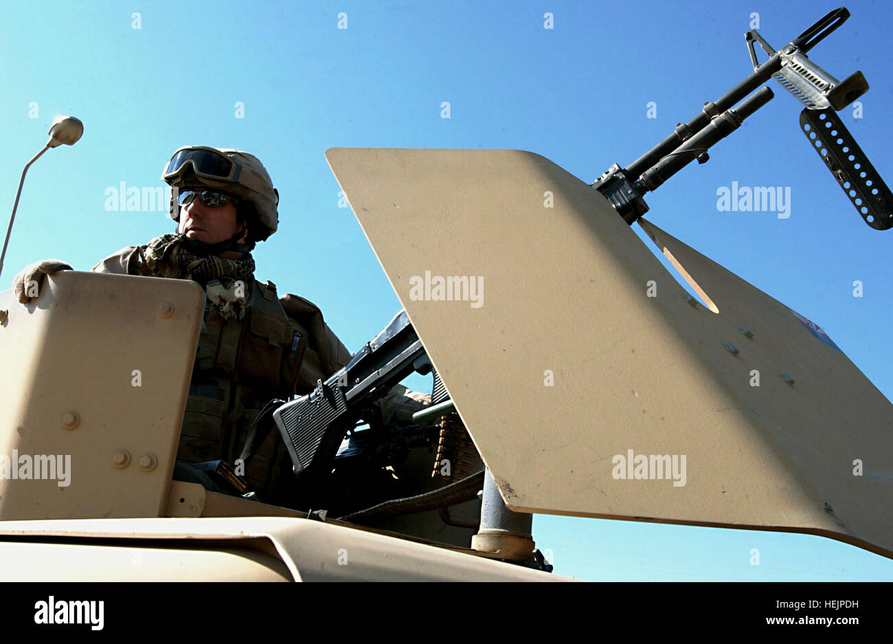 A military policeman with the 860th Military Police Company operates an ...