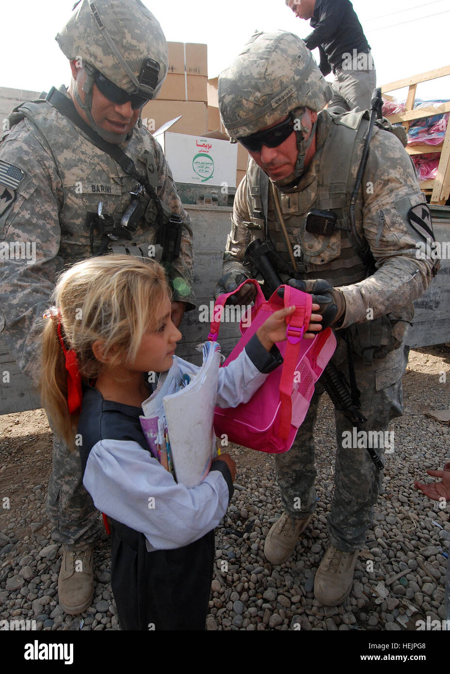 U.S. Army Staff Sgt. Samson Barini, left, assigned to C422 Civil ...