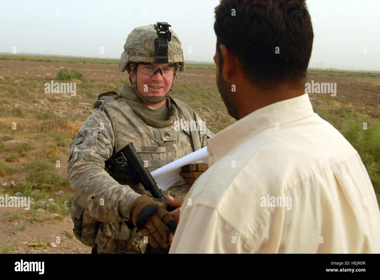 Sgt. James Grigsby, of Winston-Salem, N.C., greets a Sons of Iraq ...