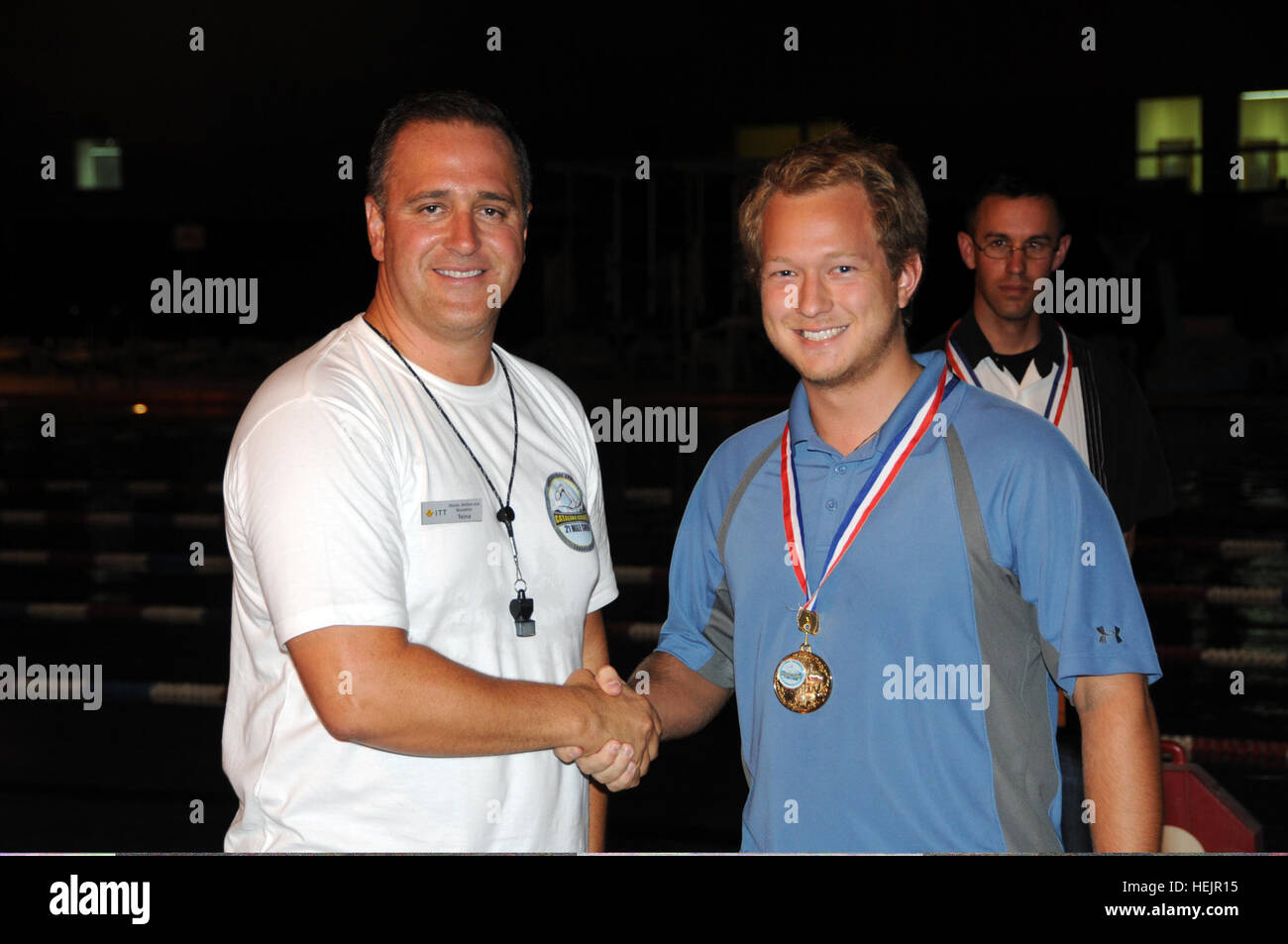 Kevin Bobsein, right, receives a gold medal from Teina J. Tahauri for ...