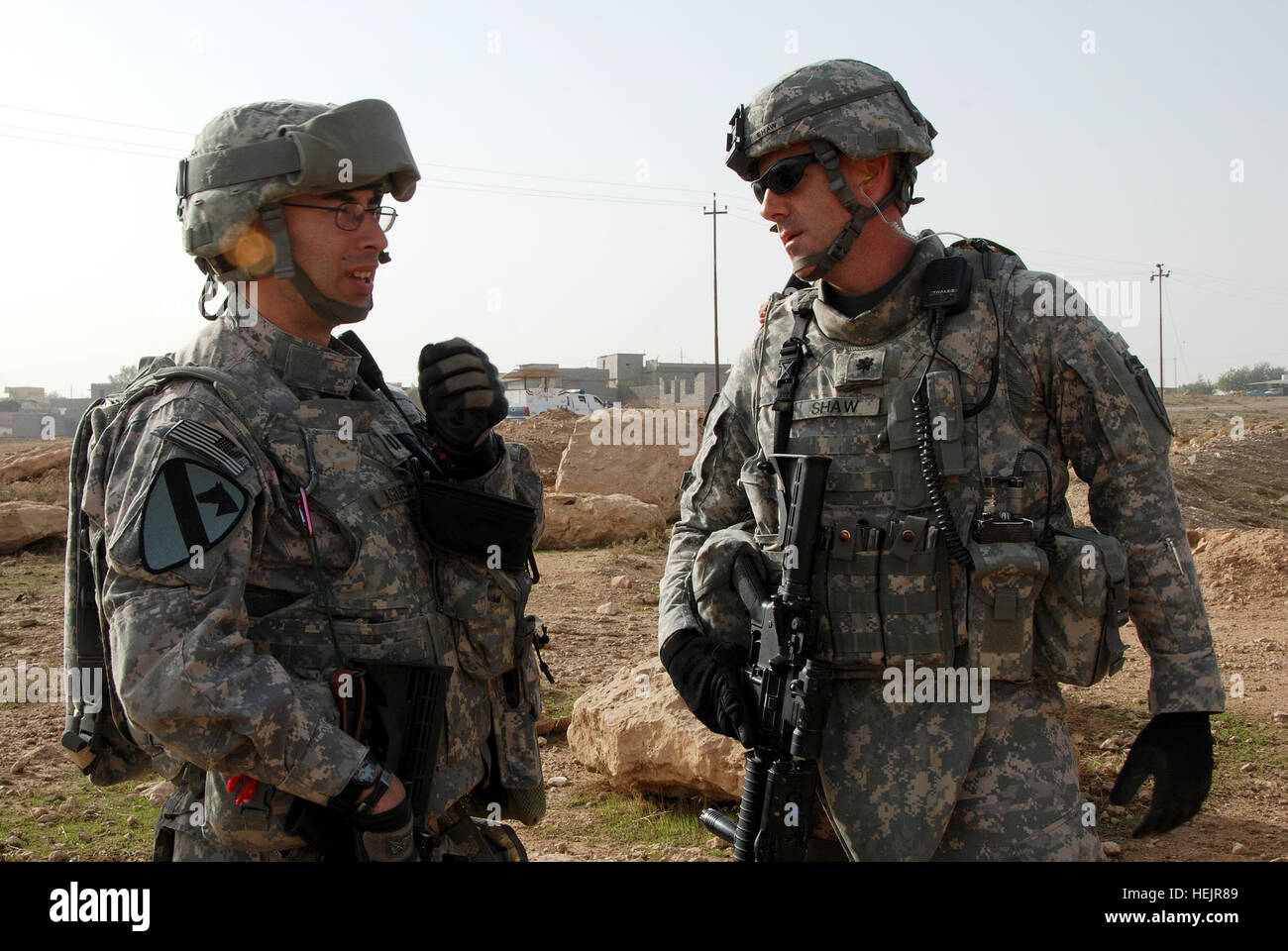 U.S. Army personnel and Iraqi Federal Police conduct a joint cordon and ...