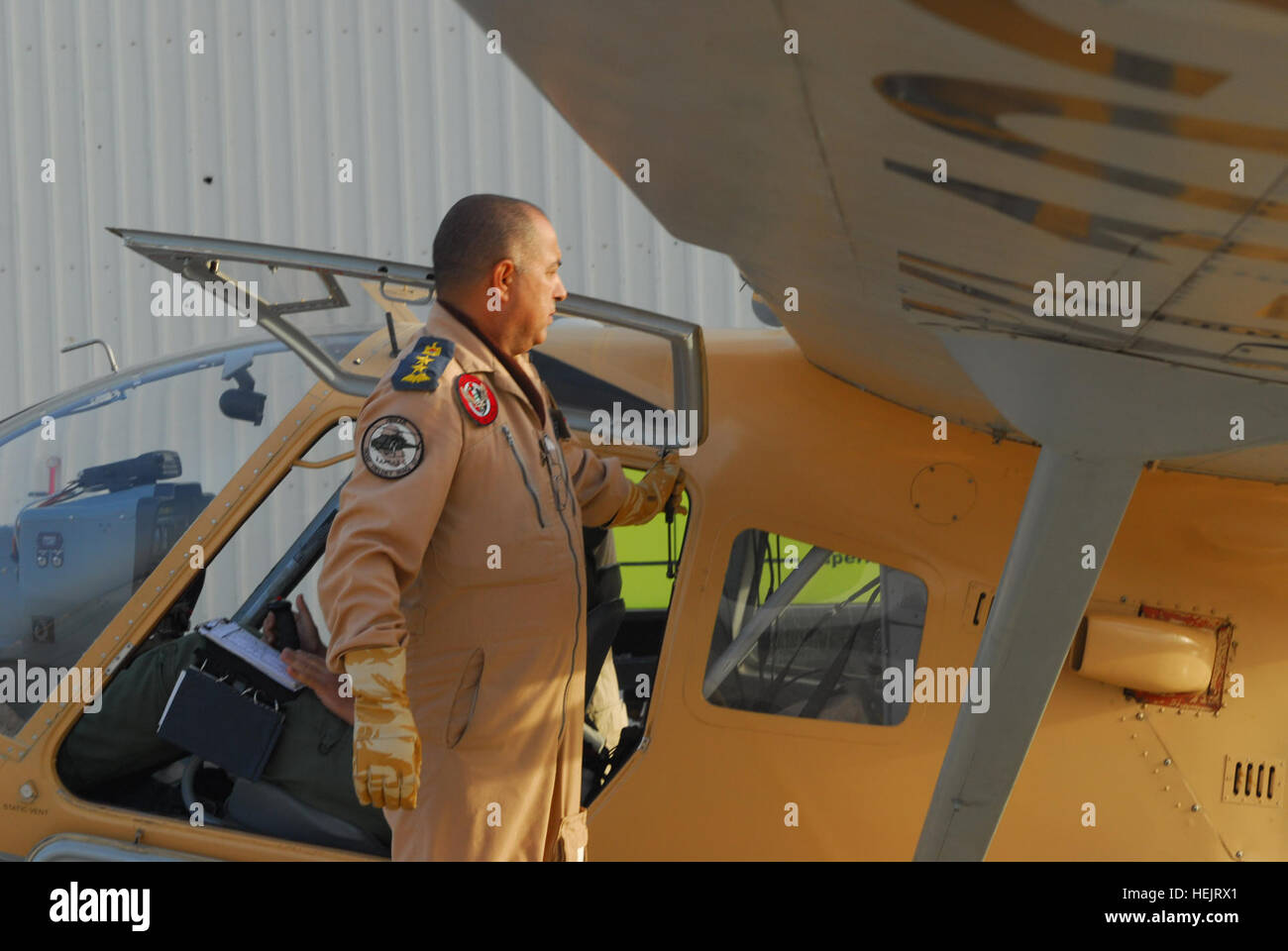 A pilot with the Iraqi Air Force 70th Squadron conducts preflight ...
